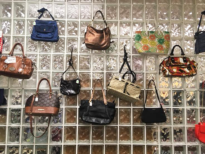 Handbags hanging like art installations. Each one has stories to tell about the places it's been and the essentials it's carried. 