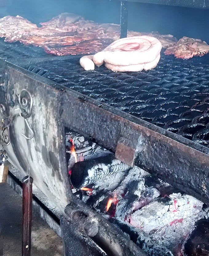 The source of all that flavor: a well-seasoned smoker where wood, fire, and time transform ordinary cuts into extraordinary meals.