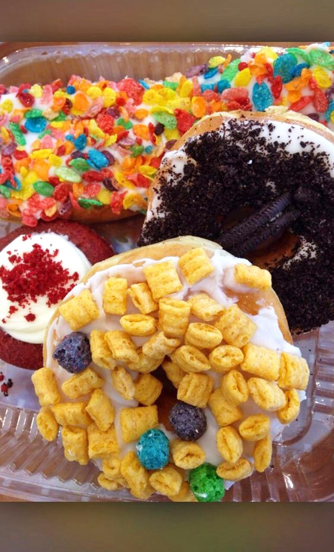 Cereal-topped donuts proving that breakfast can indeed be improved upon, especially when it involves multiple breakfast foods combined.