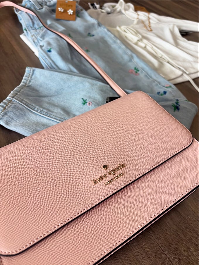 That Kate Spade blush crossbody isn't just a bag—it's proof that luxury and budget-consciousness can go hand in hand.
