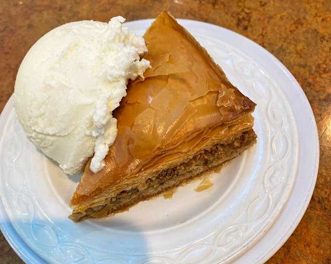 Baklava with ice cream: Where phyllo meets philosophy. One bite of this honey-soaked wonder and you'll understand why the Greeks invented democracy. 