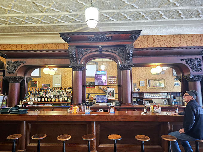 A bar that belongs in a museum, with carved wood details that remind us when craftsmanship wasn't optional but expected.