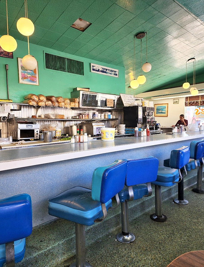 Those pendant lights and open kitchen create the perfect stage for breakfast theater and culinary magic.