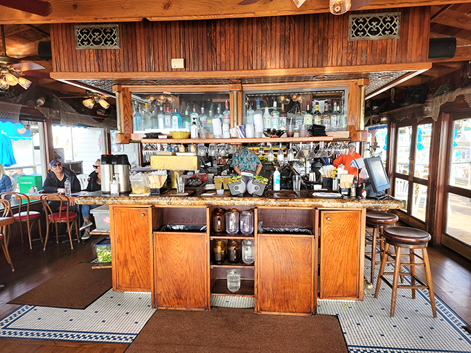 The bar area feels like the captain's quarters of a well-loved vessel, where stories flow as freely as the drinks being crafted.