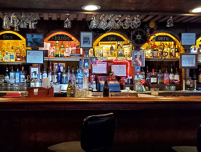 A bar that knows exactly what you need before you even say it. That "Gus thanks you very much" sign speaks volumes about hometown hospitality.