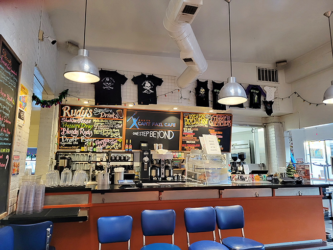 Where breakfast dreams are made: colorful chalkboard menus, hanging t-shirts, and the promise of something delicious just moments away.