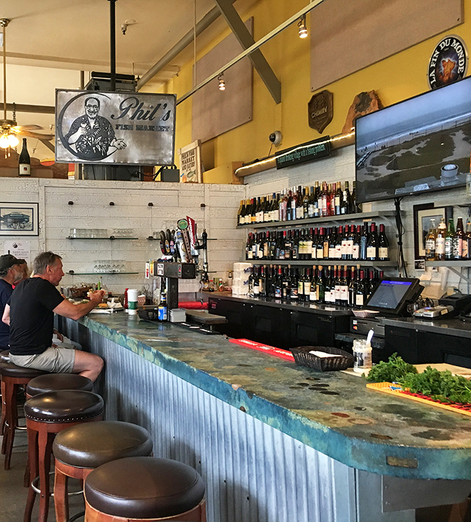 The bar area&mdash;where wine bottles stand at attention, ready to complement whatever treasure the kitchen sends your way.