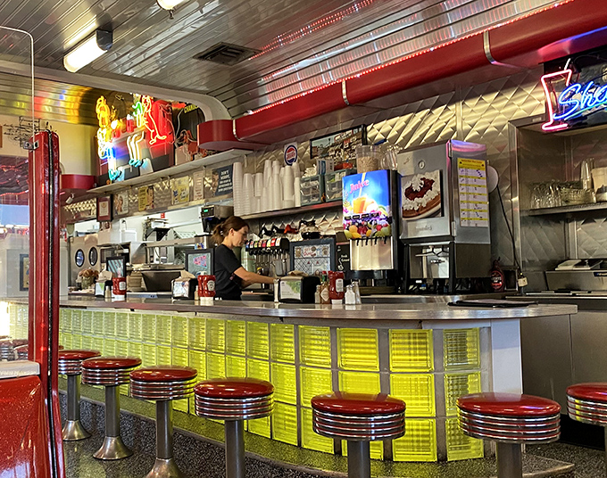 The classic diner counter offers front-row seats to the culinary theater that never gets old. 