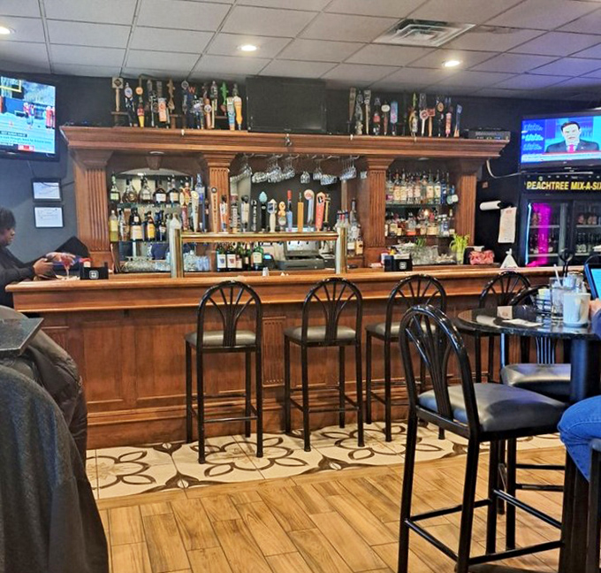 A bar that understands its purpose: cold drinks, good company, and enough TV screens to catch the game without feeling like a sports arena.