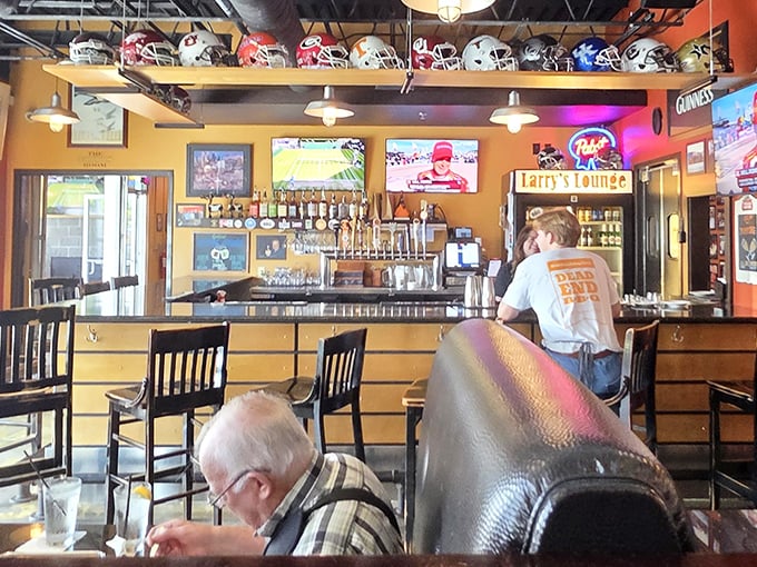 A bar area where sports, barbecue, and Tennessee pride create the perfect trifecta. Those helmets have witnessed many victory celebrations.