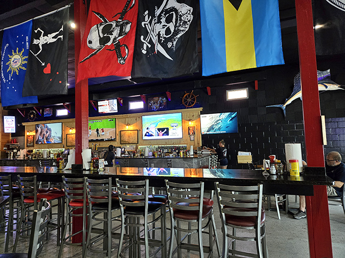 Flags hanging from the ceiling tell stories of heritage and history, while the bar below tells stories of perfectly poured pints and local legends.