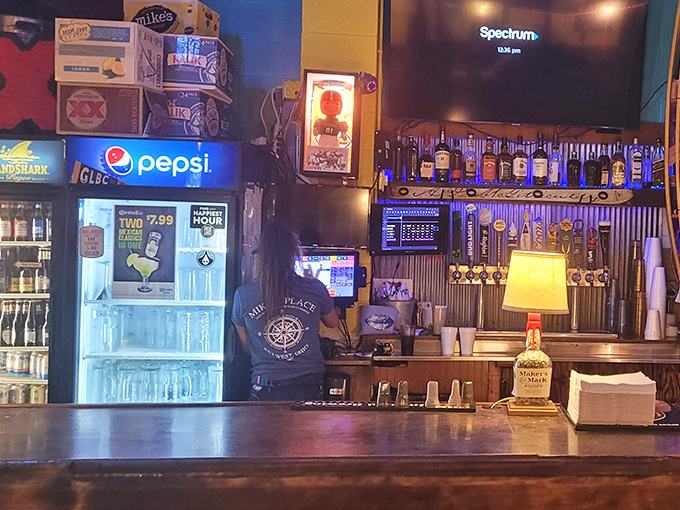 The bar at Mike's doesn't just serve drinks&mdash;it serves history. Those bottles stand at attention like soldiers guarding liquid happiness. 