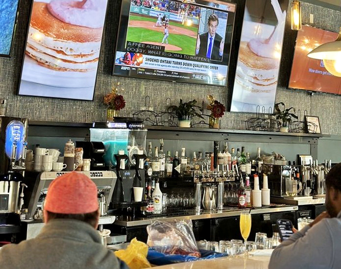 The bar area proves that breakfast cocktails deserve the same respect and creativity as their evening counterparts.
