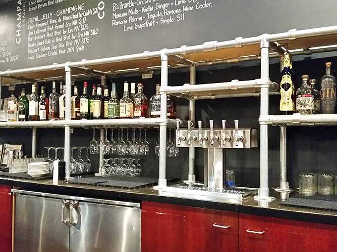 Industrial-chic shelving displays spirits like art, because good drinks deserve a proper showcase.