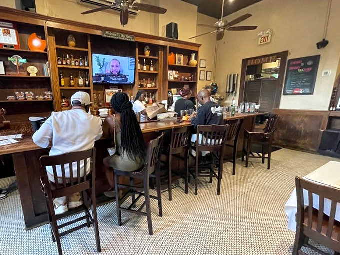 The bar serves up liquid comfort to match the food. That Hennessy Sidecar has developed a following that borders on religious devotion.