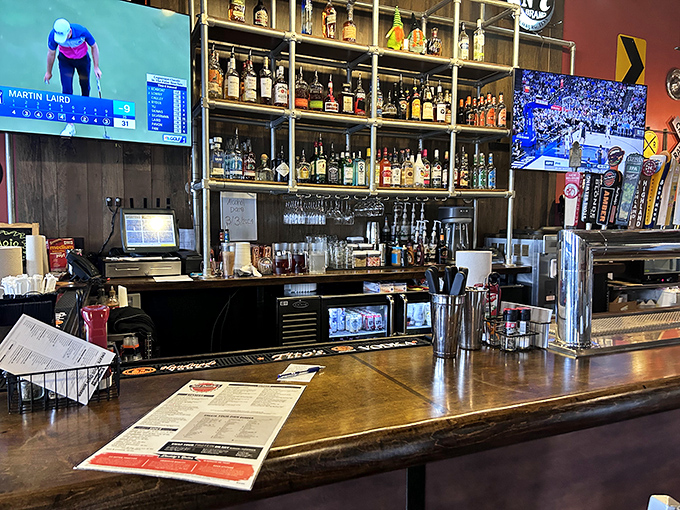 The bar showcases an impressive arsenal of spirits, ready to complement your burger adventure with liquid reinforcements.