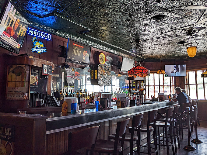 The bar area feels frozen in time&mdash;in the best possible way. Vintage lighting and well-worn wood create the perfect spot for contemplating your next hot dog order.