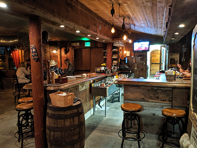 The bar area where locals gather to debate the finer points of beef cuts and canyon living.