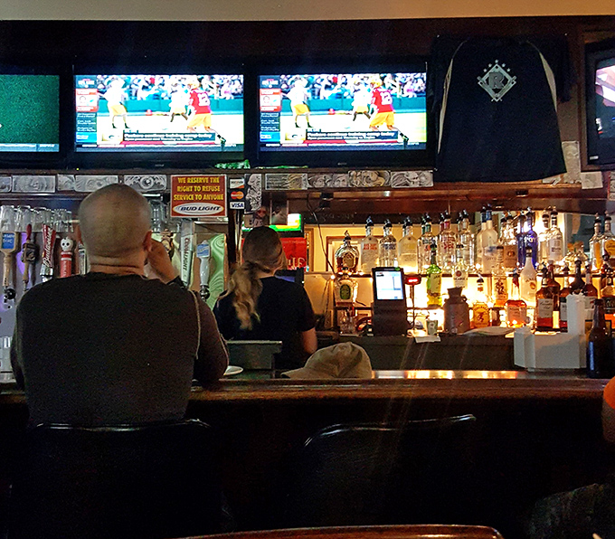 A well-stocked bar where sports fans gather to cheer on Ohio teams while bartenders pour with generous hands.