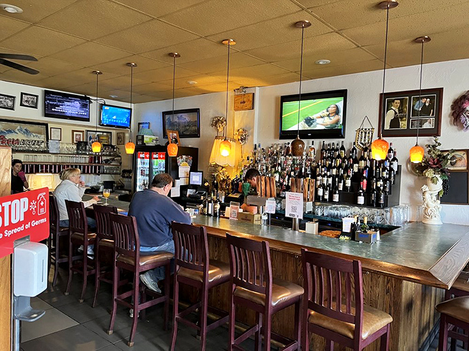The bar area beckons with promises of perfectly mixed drinks and friendly neighborhood conversation.