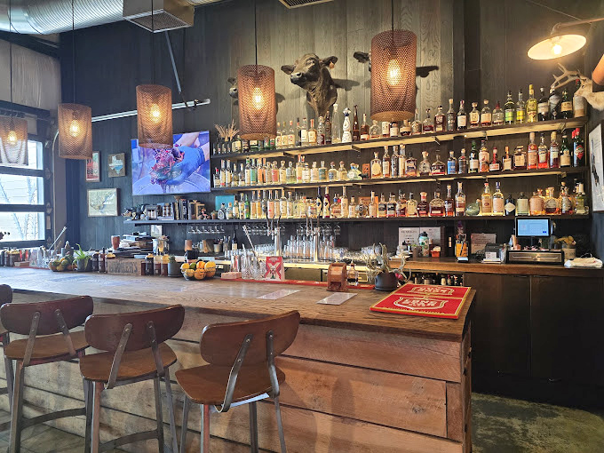 A bar that understands bourbon and barbecue belong together like Astaire and Rogers. Those cow heads silently approve your choices.