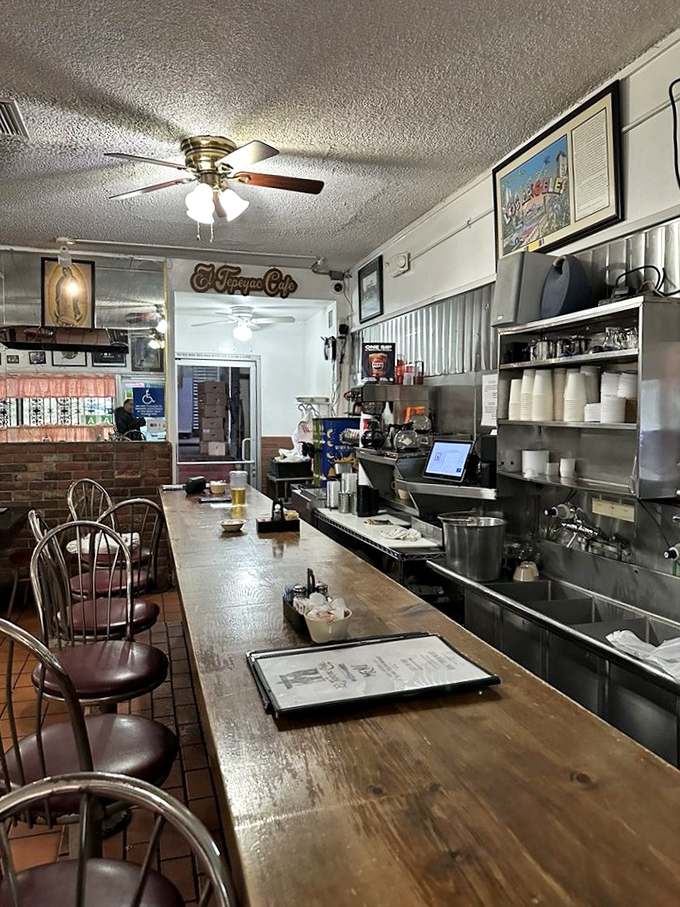 The counter where dreams begin and diets end. Notice the well-worn wood&mdash;polished by the elbows of decades of hungry patrons.
