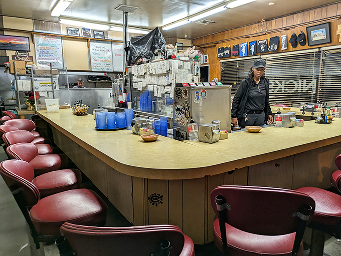 The counter—where solo diners find community, regulars find their usual spots, and everyone finds that the best conversations happen over coffee refills.