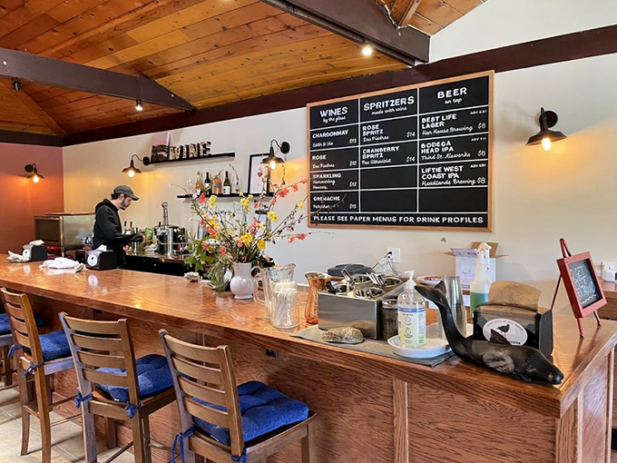 The bar where liquid happiness flows alongside ocean delights. That chalkboard menu promises wine pairings that make seafood sing even louder.