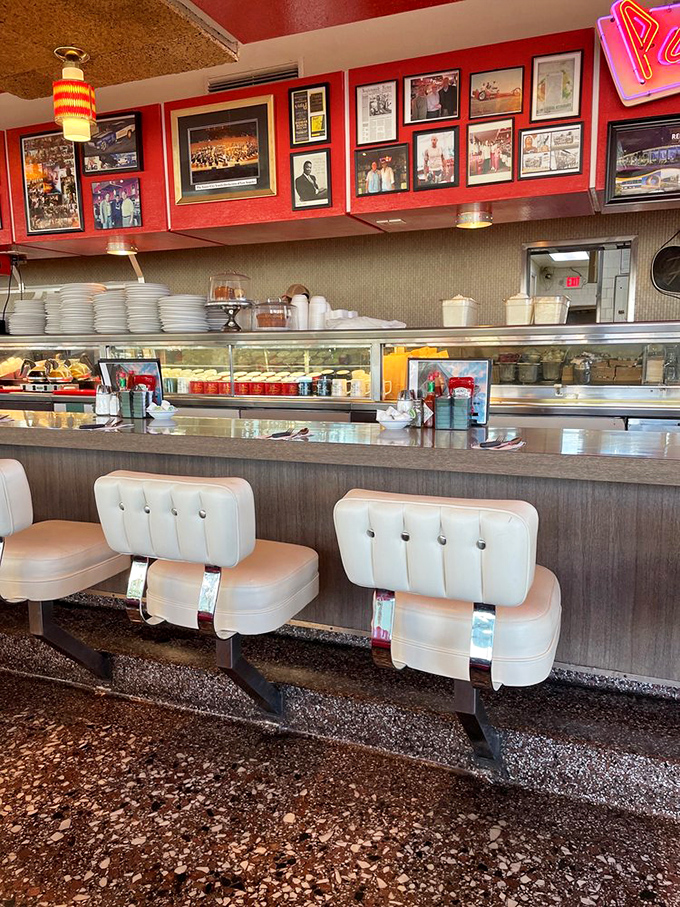 The counter isn't just seating&mdash;it's theater-in-the-round where you can watch short-order cooking elevated to an art form while vintage photos document decades of history above.