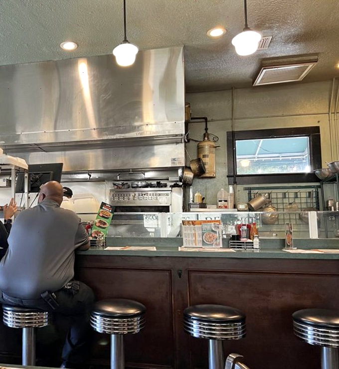 Counter seats: where solo diners become breakfast philosophers and the short-order cooks are the wisest sages in town.