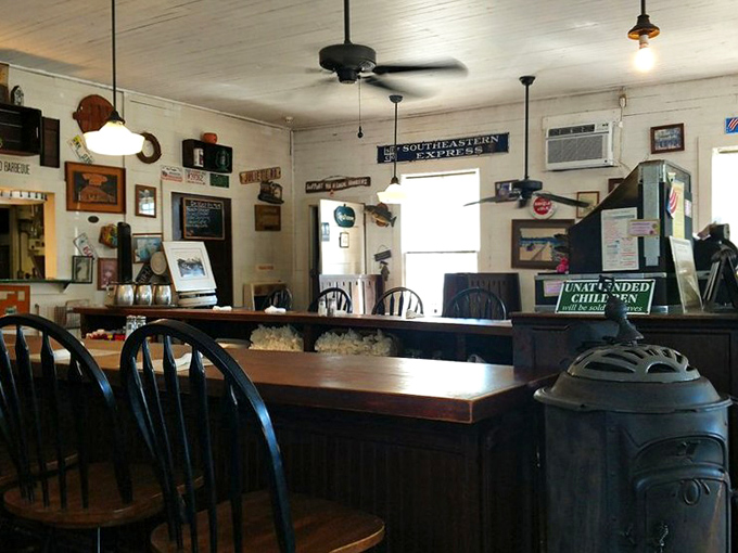 Counter seating that's witnessed decades of local gossip and out-of-towners falling in love with Southern cooking. That sign about prices changing with attitude? Pure truth.