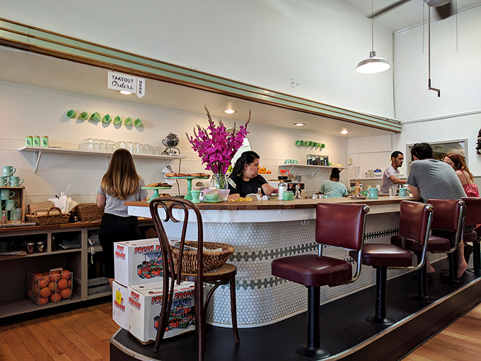 The counter where breakfast dreams come true. Those burgundy stools have witnessed countless first dates, business deals, and "this changed my life" food moments.