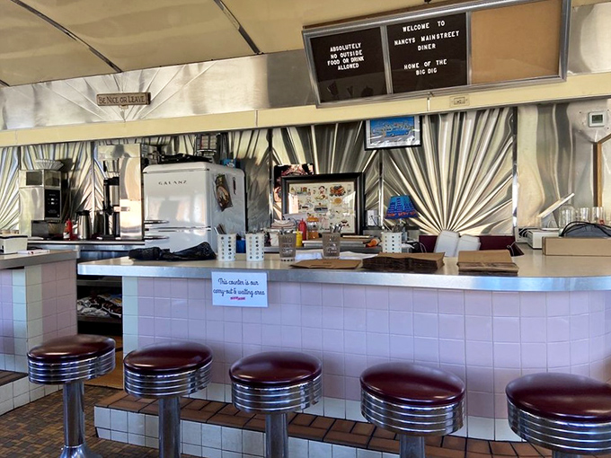 The counter where strangers become neighbors. That "Reserved" sign? It's for your future self&mdash;you'll be back tomorrow.