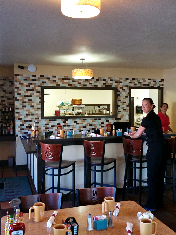 The counter where breakfast magic happens. Those stools have heard more morning confessions than most bartenders hear at night.