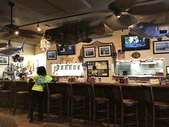 The bar at Mike's&mdash;where fish tales get taller and cocktails get stronger. Those mounted catches have heard every fishing story ever told.