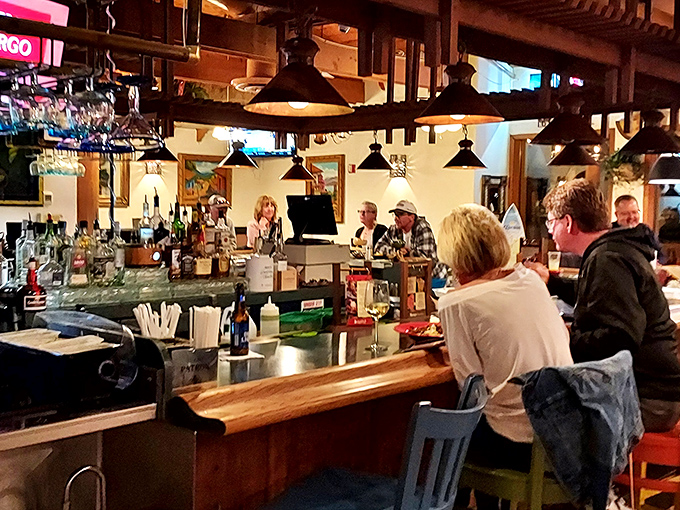 The bar area where margaritas flow and friendships deepen over perfectly salted rims and good conversation. 