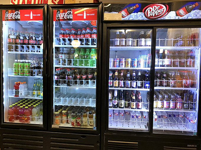 The drink coolers at Stanton's&mdash;where your beverage waits patiently to help you survive the glorious assault of flavors heading your way.