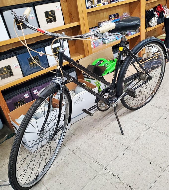 A classic black bicycle stands ready for its next adventure&mdash;proof that good design never goes out of style, especially when it comes with two wheels.