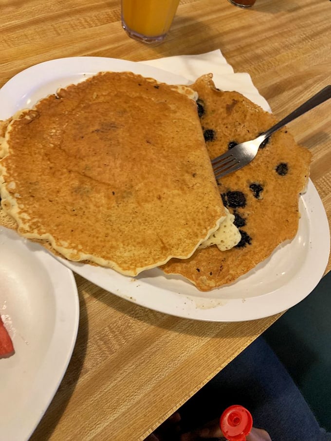 Blueberry pancakes that are essentially breakfast's way of saying, "You deserve something special today." The fork is already planning its attack.