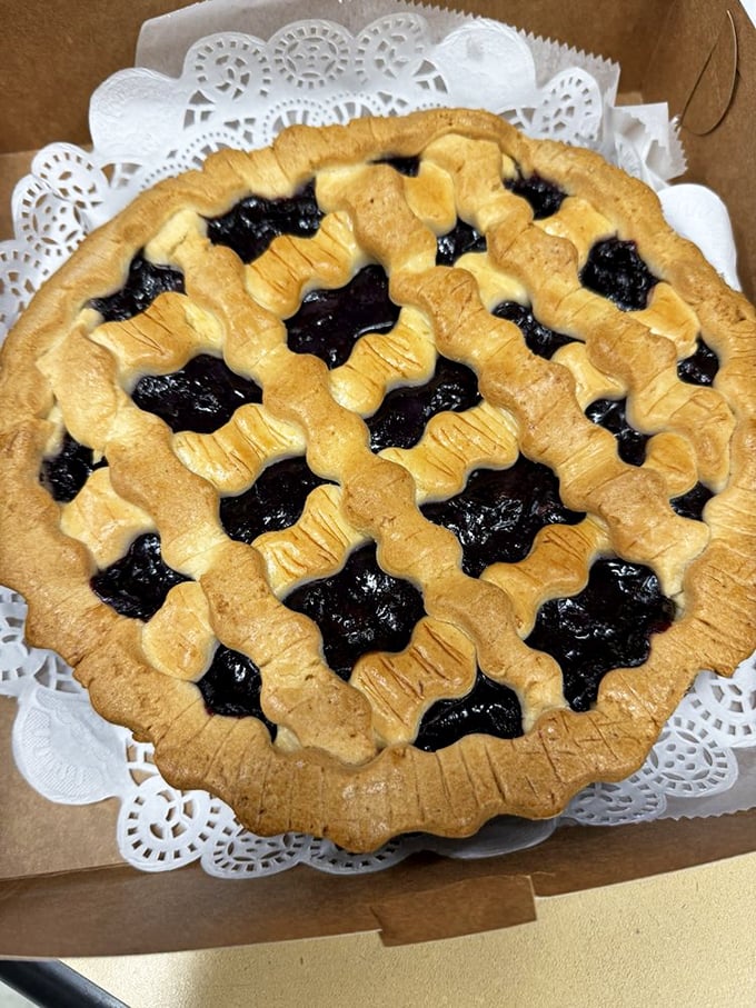 Blueberry pie that looks like summer decided to take up permanent residence in a pastry shell.