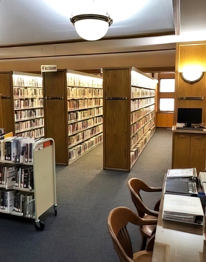 Rows upon rows of literary adventures await. These wooden shelves have held generations of stories, from classics to contemporary bestsellers.