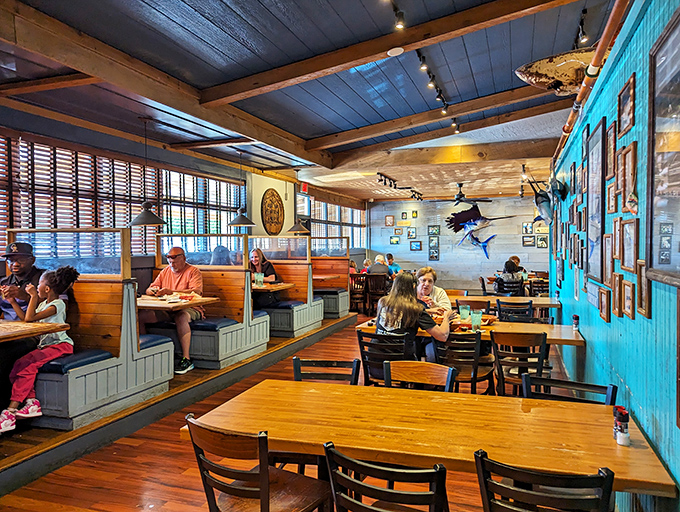 This cozy corner with fishing photos feels like your favorite uncle's beach house&mdash;if your uncle were a world-class seafood chef.