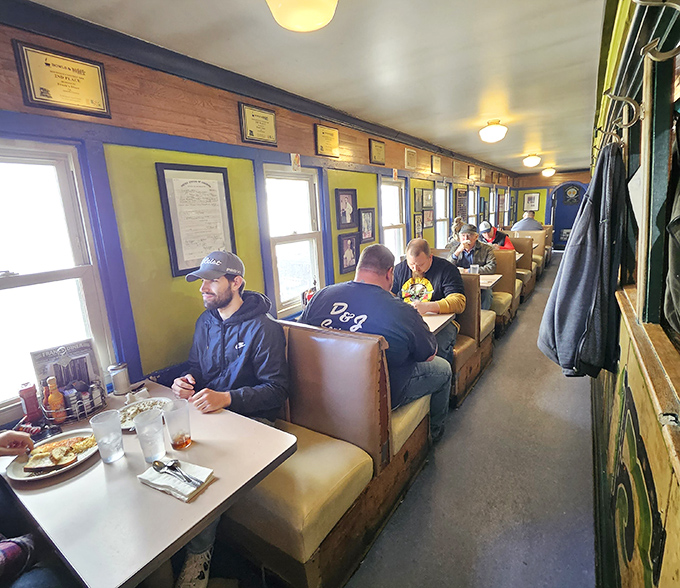 The railroad car dining room creates an atmosphere where strangers become neighbors and calories don't count because you're technically traveling.