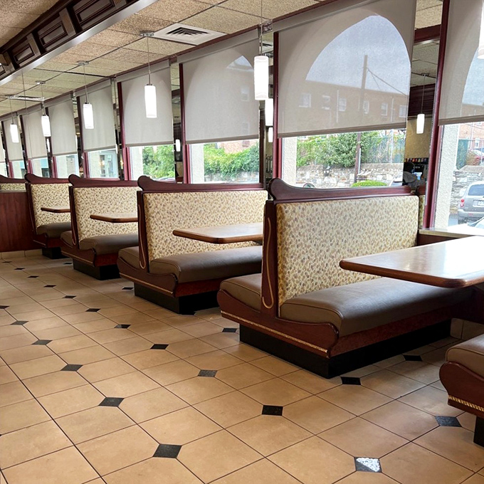 Classic diner booths line the windows, offering the perfect perch for people-watching while contemplating life's big questions, like "Pie or cake?"