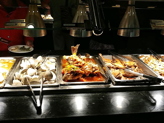 A buffet spread that makes decision-making the hardest part of your meal. The heat lamps here are working overtime to keep everything just right.