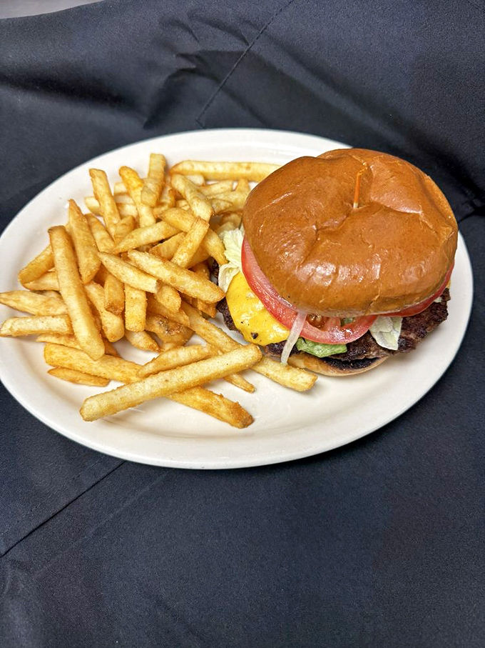 A burger that doesn't need a fancy name or artisanal pretensions—just quality ingredients stacked between a perfectly toasted bun. America on a plate.