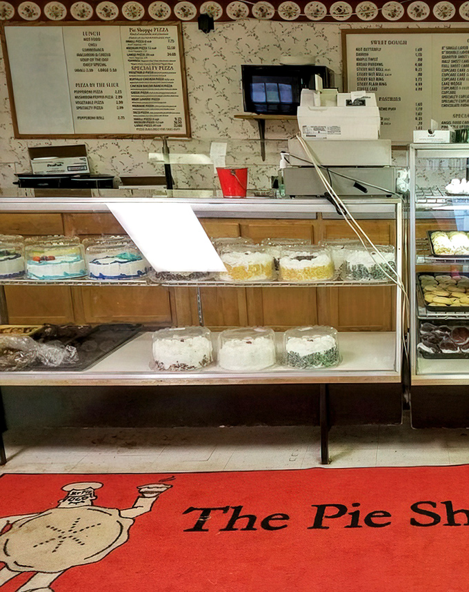 Behind glass cases that showcase edible treasures, the counter serves as both transaction point and the gateway to carbohydrate heaven.