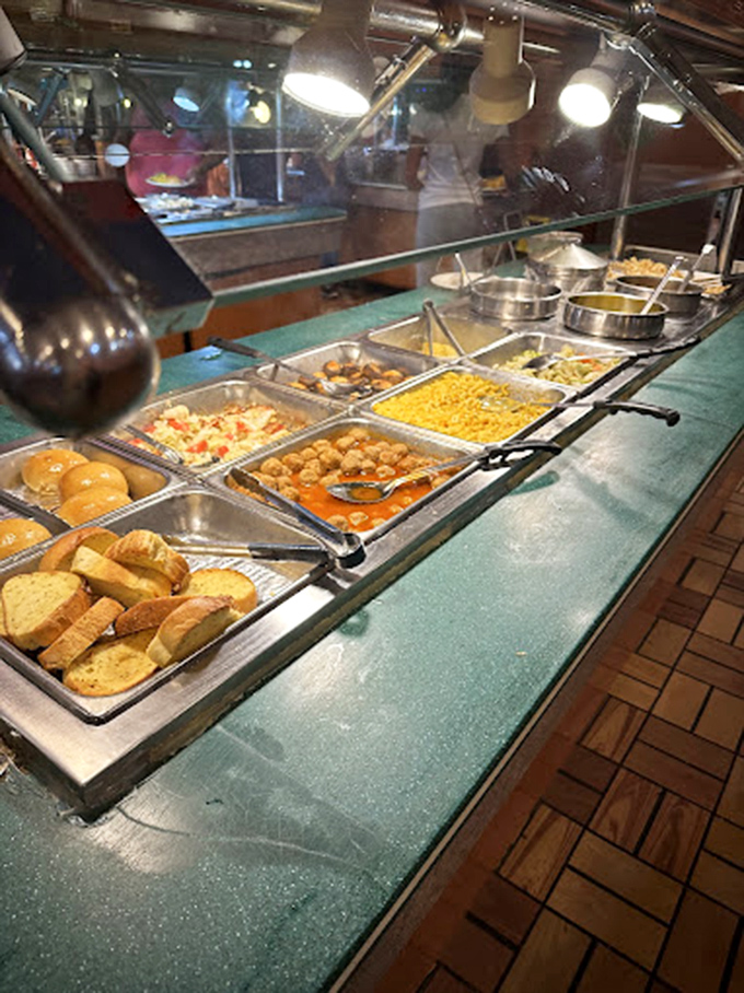 The hot food line stands ready for action, like a well-organized army prepared to battle hunger on multiple fronts simultaneously.