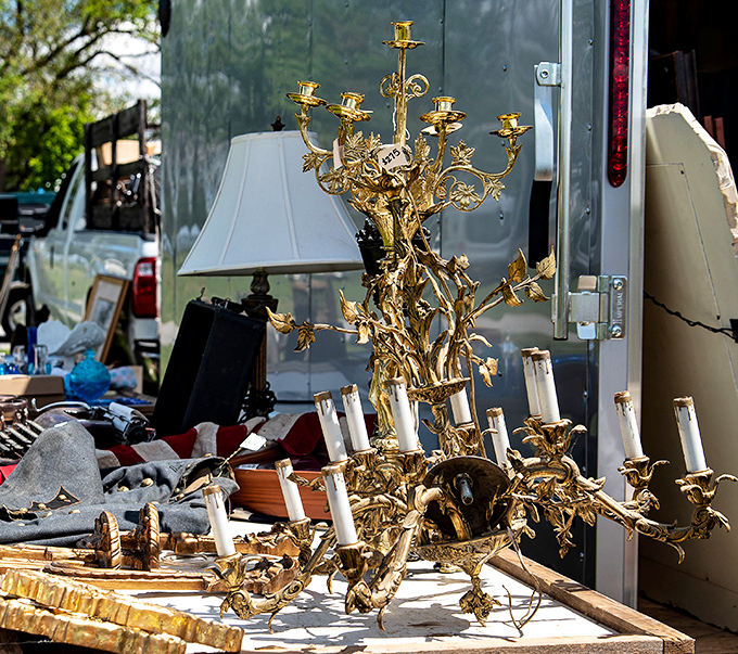 A gold chandelier that's either gloriously gaudy or absolutely magnificent&mdash;sometimes the line between tacky and treasure is delightfully thin.