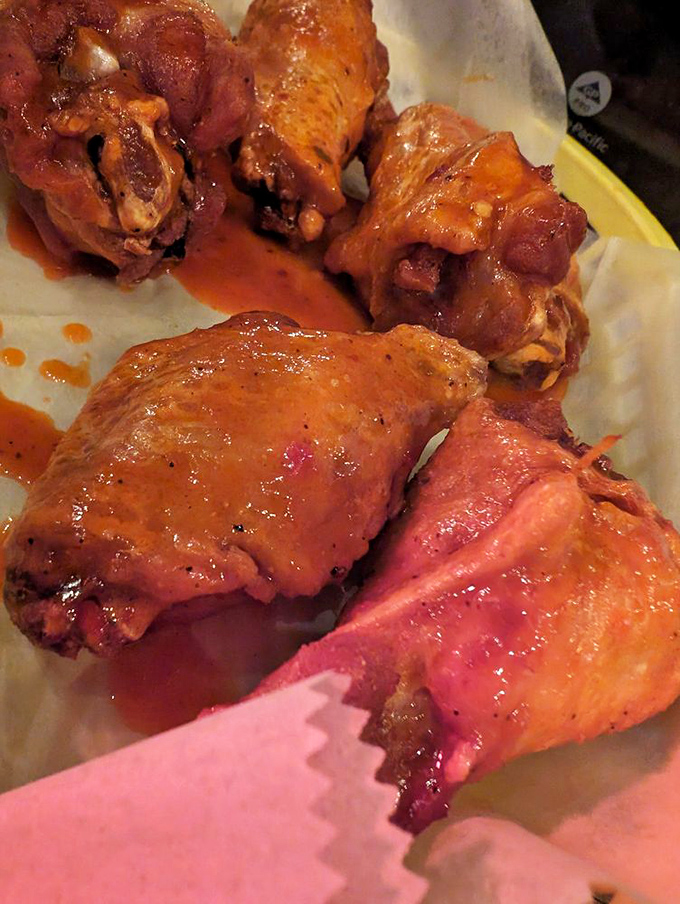 Wings that don't need a sporting event excuse. Glossy with sauce and perfectly cooked, they're the reason napkins were invented.